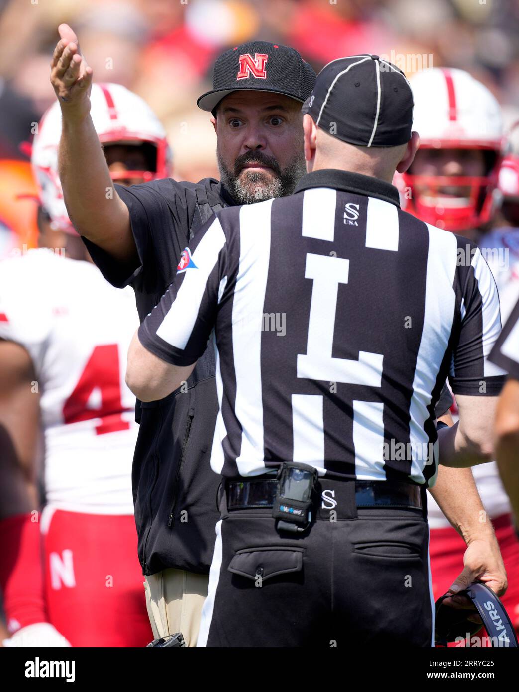 Nebraska head coach Matt Rhule, back, argues for a call in the second ...