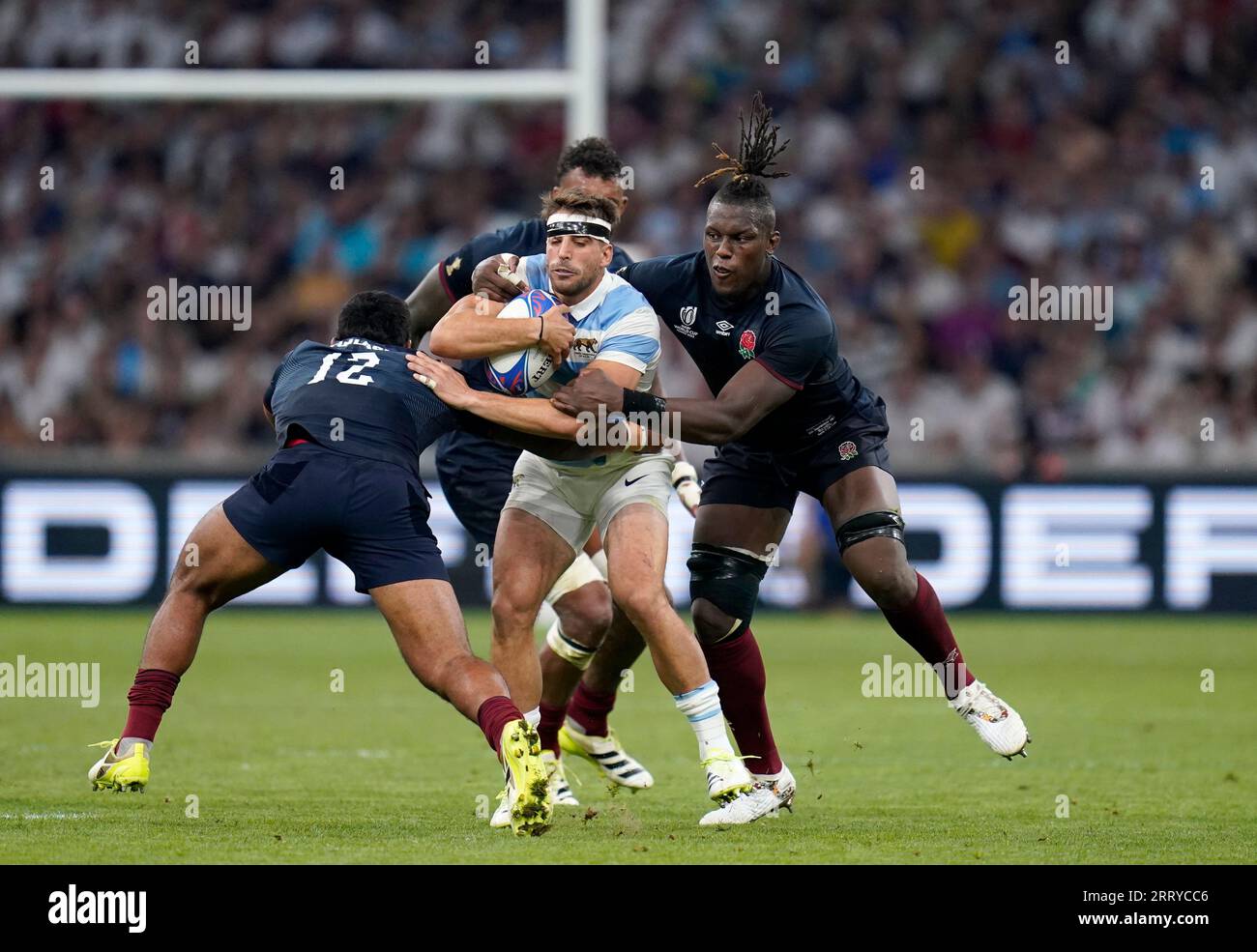 Argentina's Juan Cruz Mallia (centre) is tackled by England's Manu ...