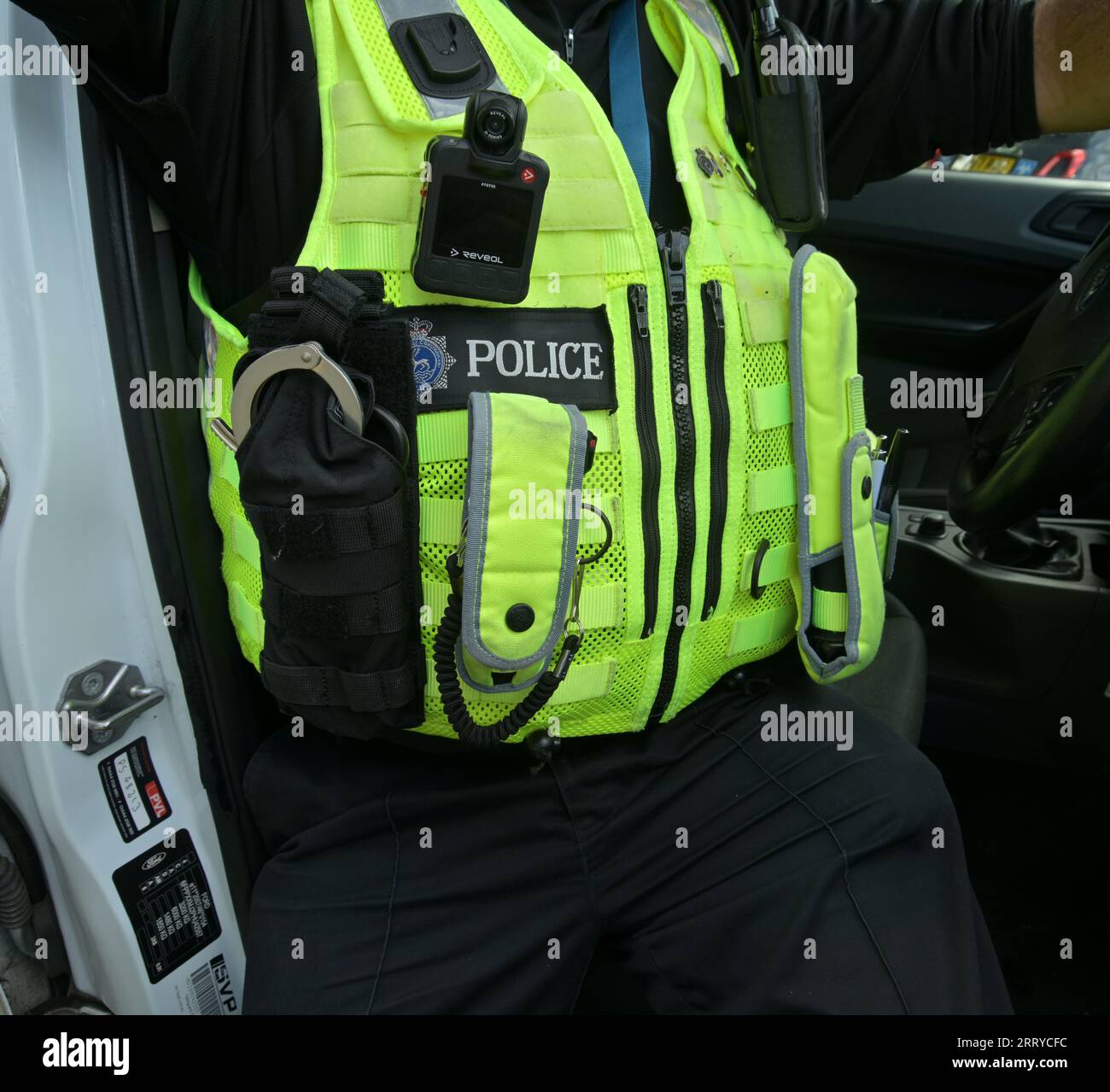 Police hi vis Tactical patrol vest with handcuffs and bodycam Stock ...