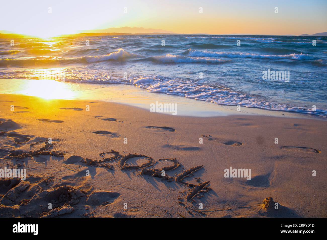 The number 2024 written in the sand on the beach. new year 2024 concept ...
