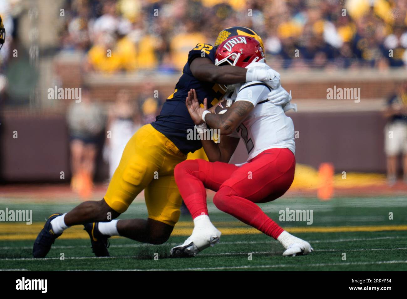 Michigan defensive end Jaylen Harrell (32) sacks UNLV quarterback Doug ...