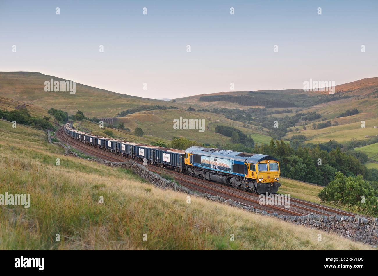GB Railfreight class 66 diesel locomotive hauling a freight train ...