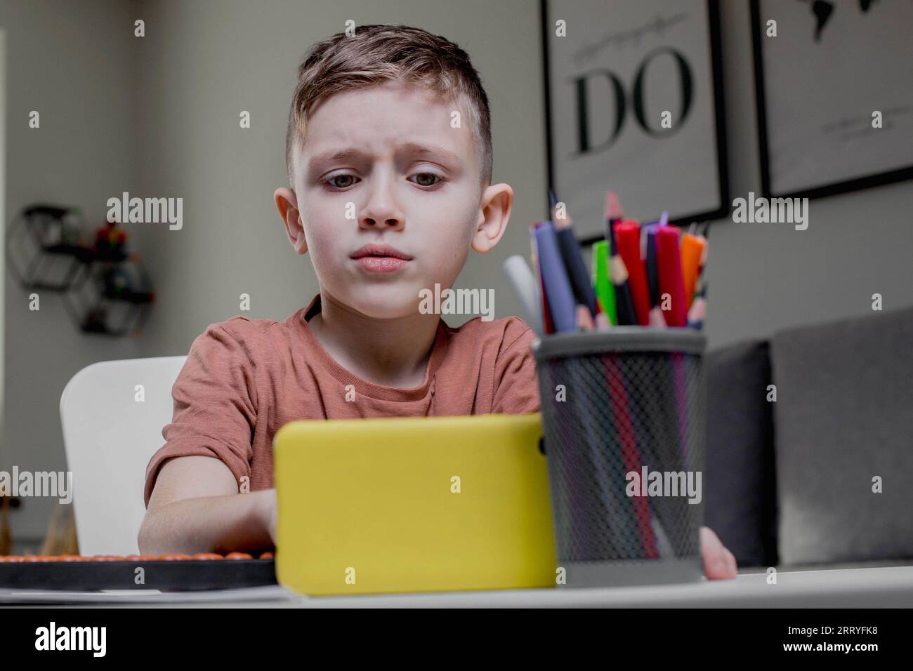 Boy is thinking about solving the problem. Mental arithmetic. Adding ...