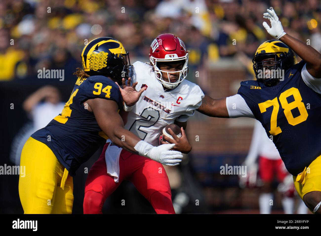 UNLV quarterback Doug Brumfield (2) is sacked by Michigan defensive ...