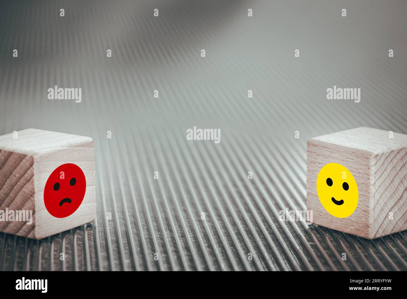 Bipolar disorder, two blocks concept with happy and sad face icons ...