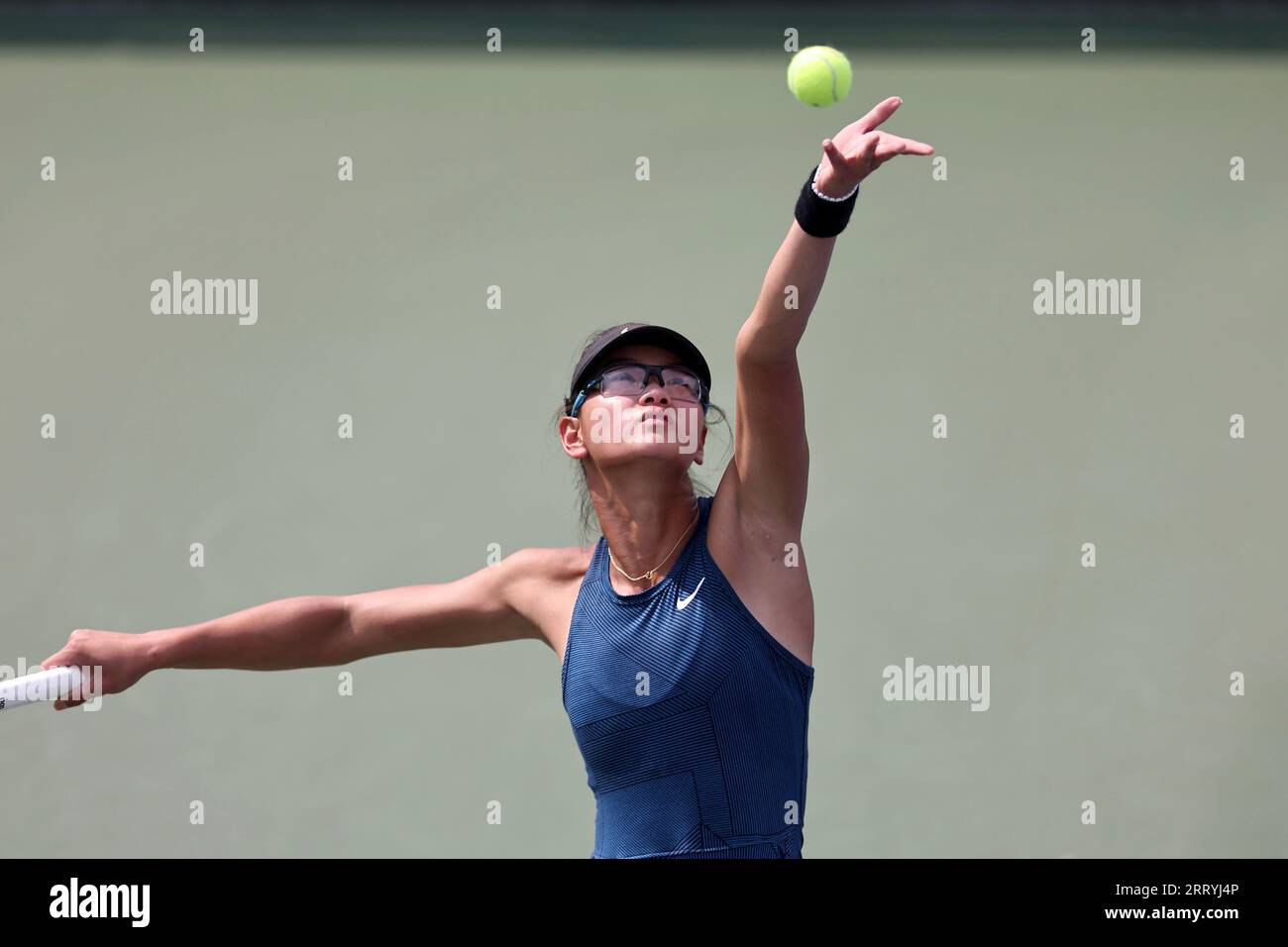 Maylee Phelps serves during a junior wheelchair girls' singles ...