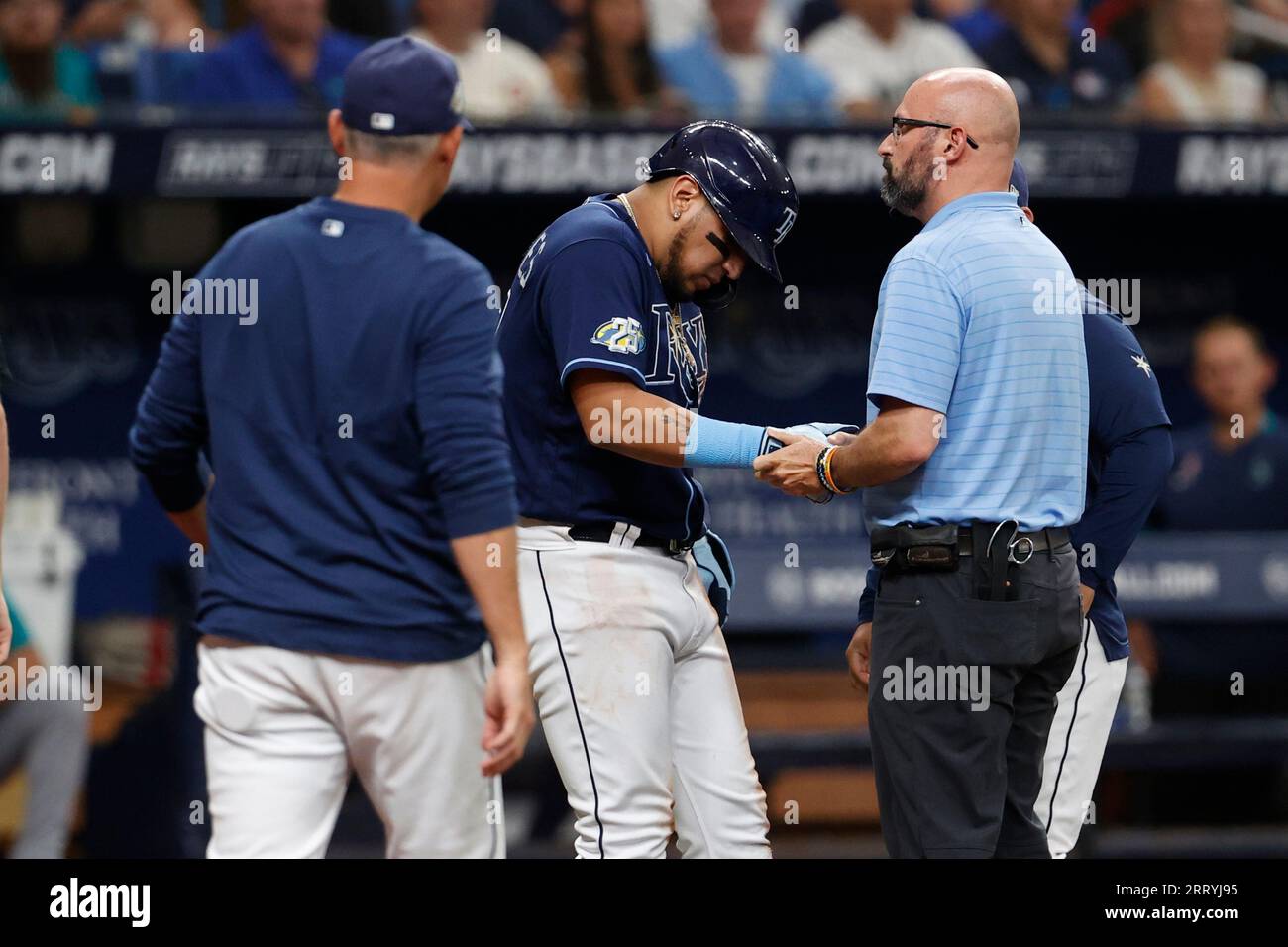 Tampa Bay Rays head athletic trainer Joe Benge, right, examines the ...