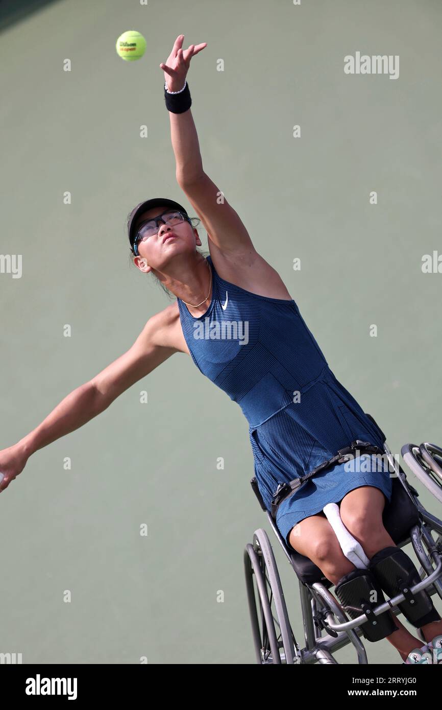 Maylee Phelps serves during a junior wheelchair girls' singles ...