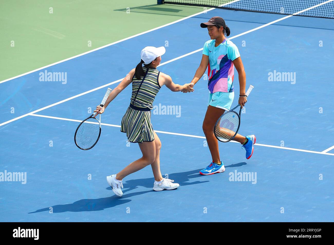 Hayu Kinoshita and Wakana Sonobe react during a junior girls' doubles ... Hayu Kinoshita and Wakana Sonobe react during a junior girls' doubles ...