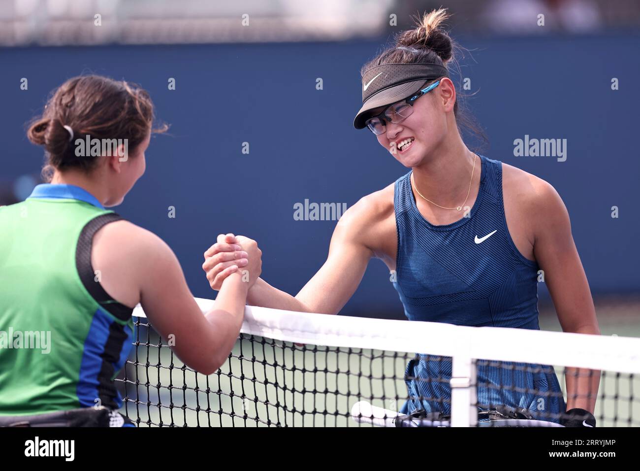 Maylee Phelps shakes hands with Ksenia Chasteau at the net during the ...