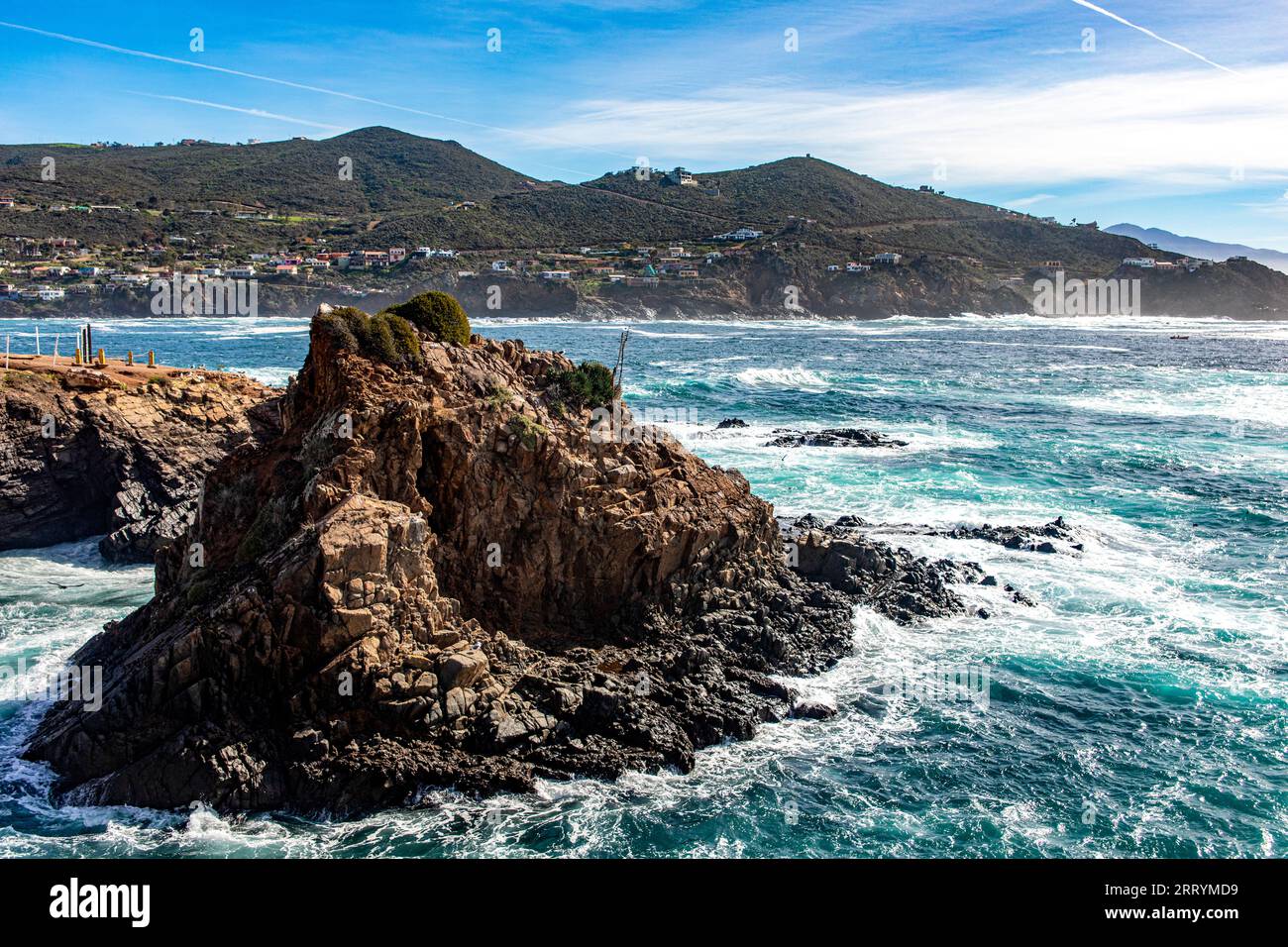 Photograph of an islet in La Bufadora which is a marine geyser in ...