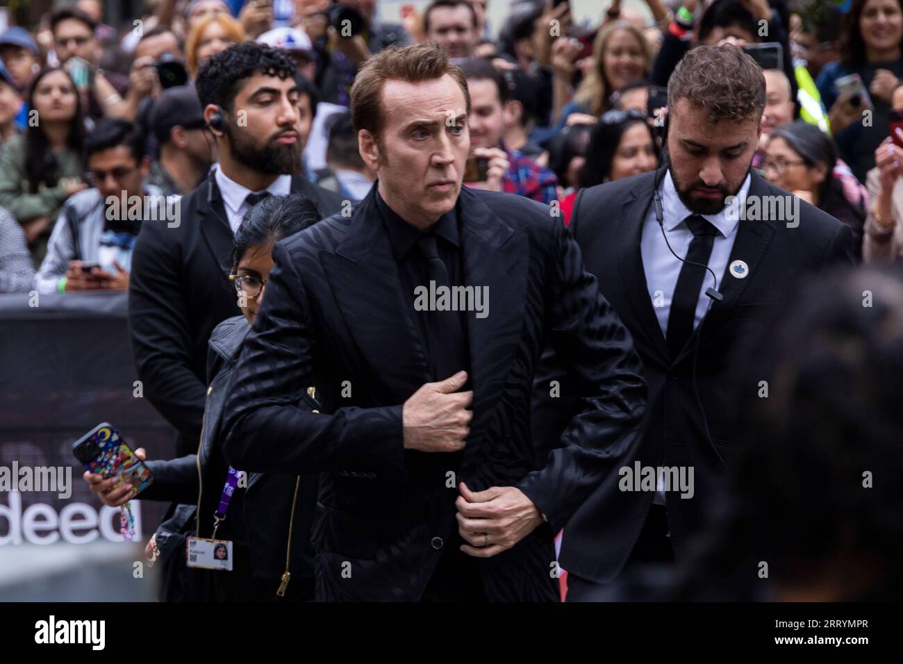 Nicolas Cage walks over to greet fans as he attends the premiere of ...