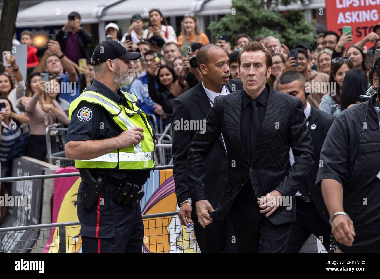 Nicolas Cage walks over to greet fans as he attends the premiere of ...