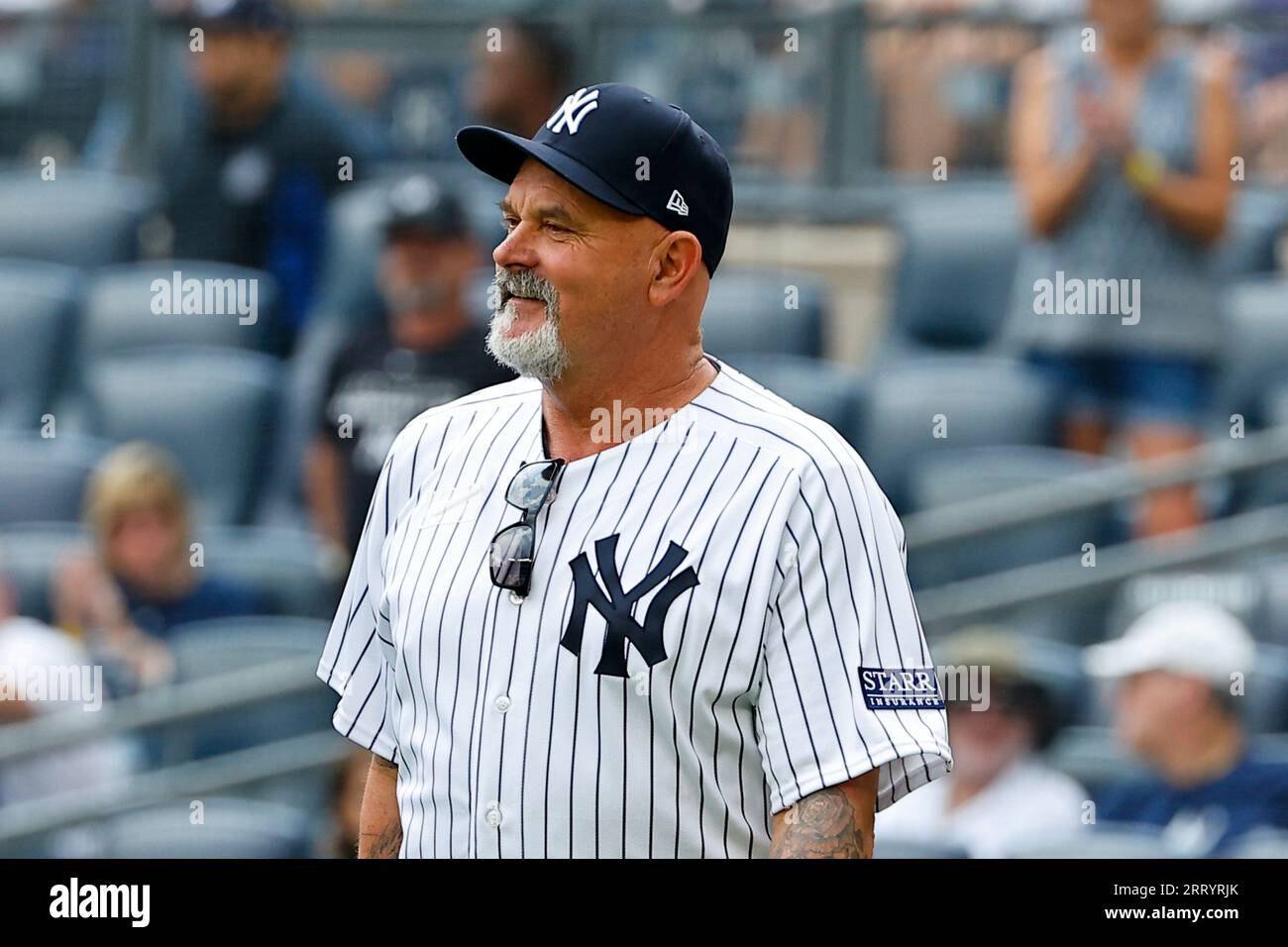 BRONX, NY - SEPTEMBER 09: David Wells covers the Nike logo on his ...
