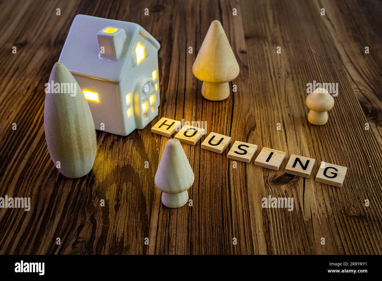 housing wooden letters ceramic house background, housing crisis real ...