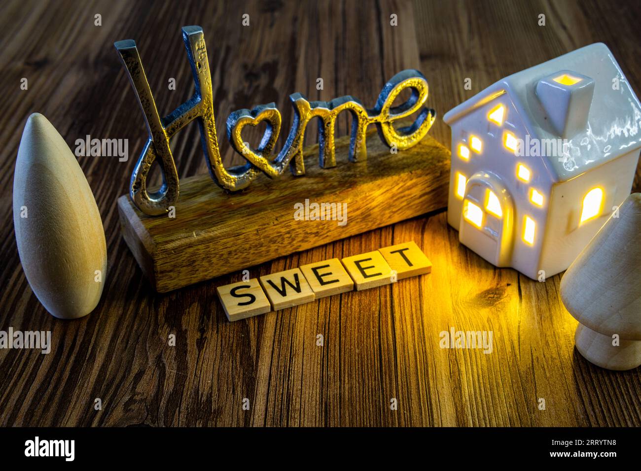 home sweet home sign ceramic house with bright wavy light on in the ...