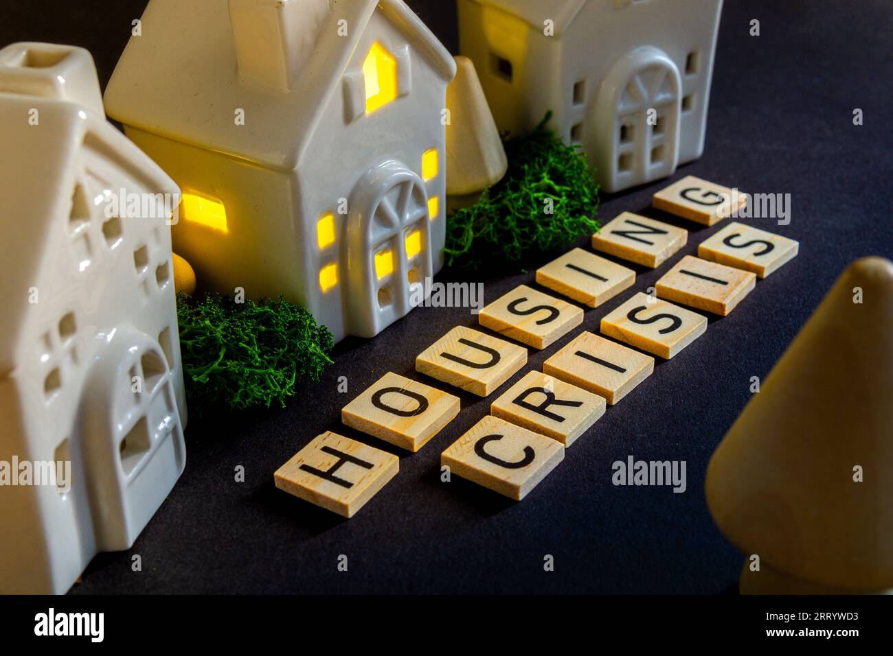 housing crisis in wooden letters crossword puzzle ceramic house with ...