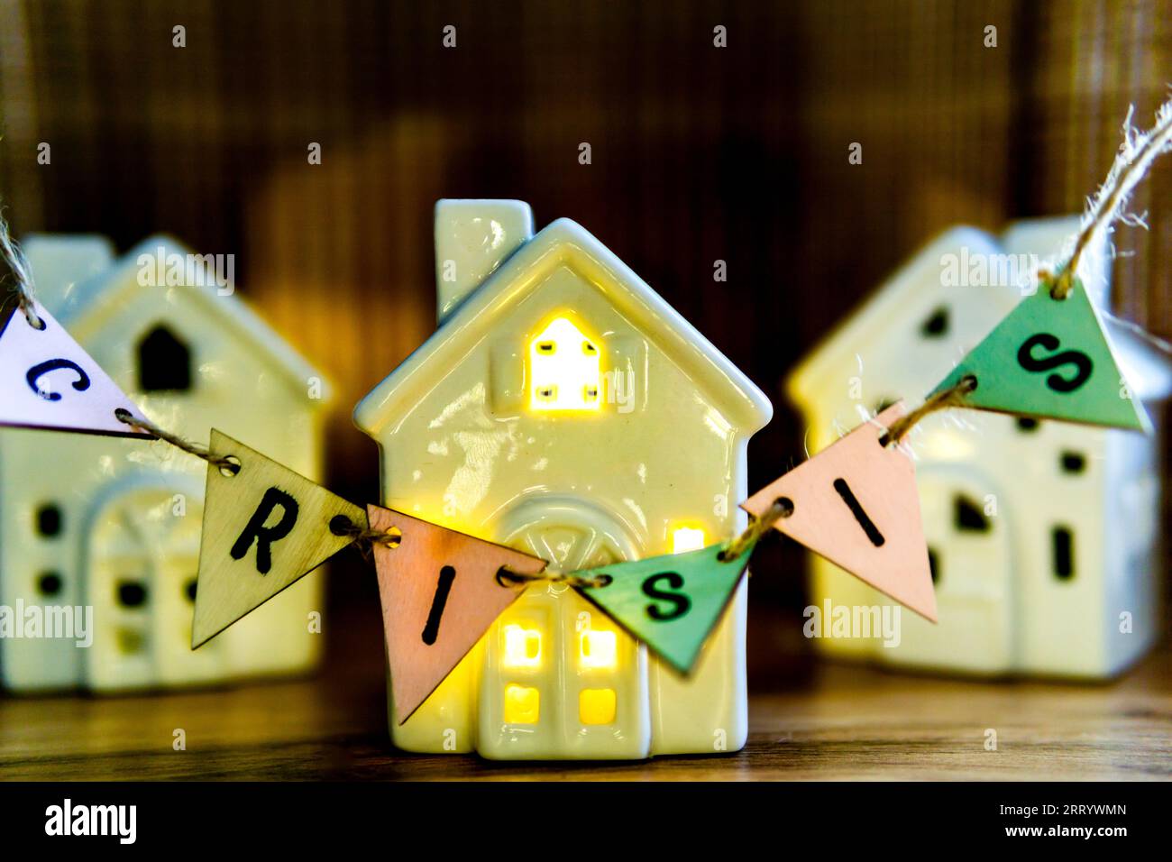housing crisis concept illustration in wooden letters it ceramic houses ...