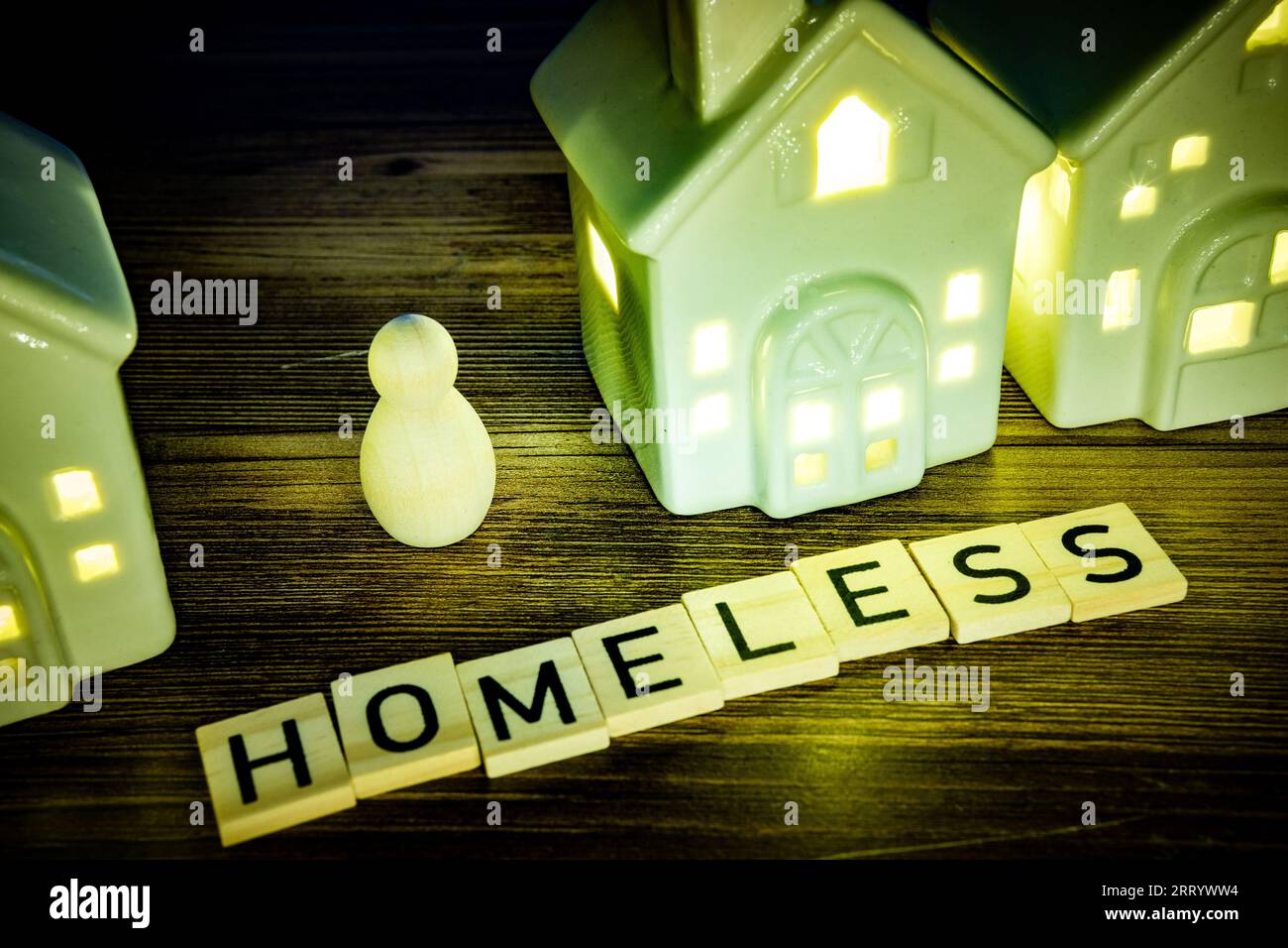 word homeless in wooden letters on a wood background, a wooden figure ...
