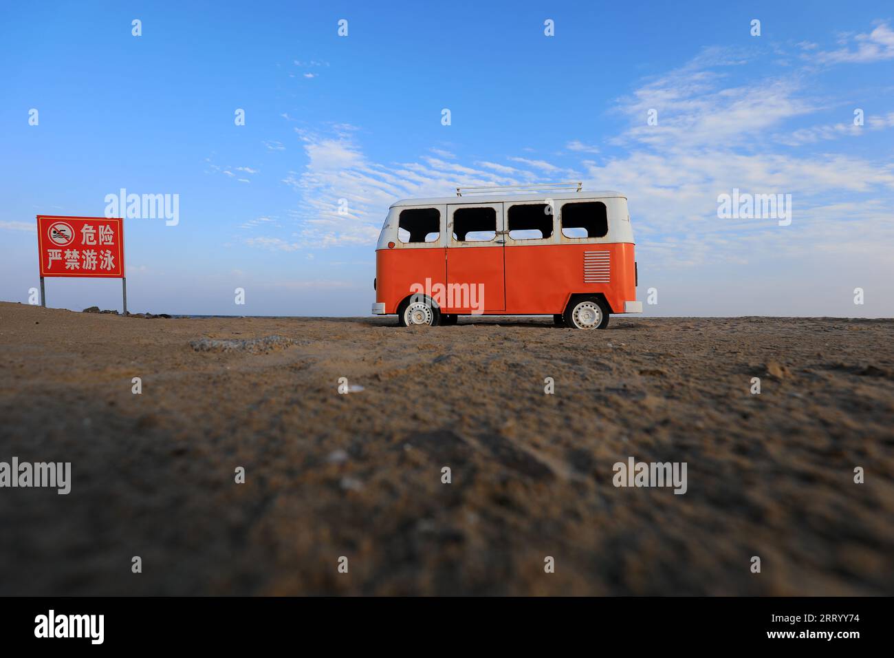 The red bus model is on the beach at a scenic spot Stock Photo - Alamy