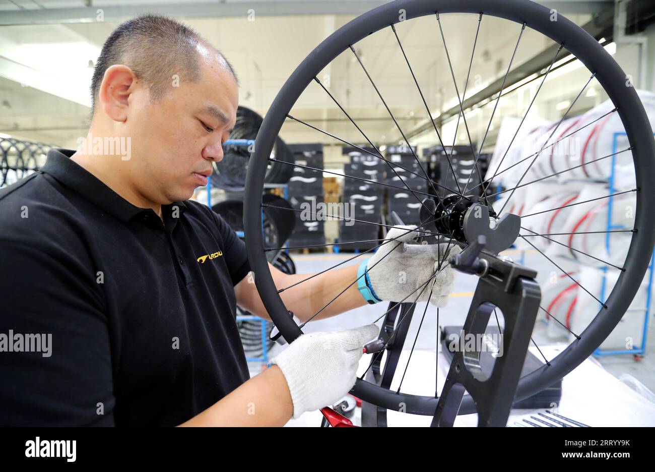 LELING, CHINA - SEPTEMBER 9,2023 - A worker adjusts a wheel set at a ...