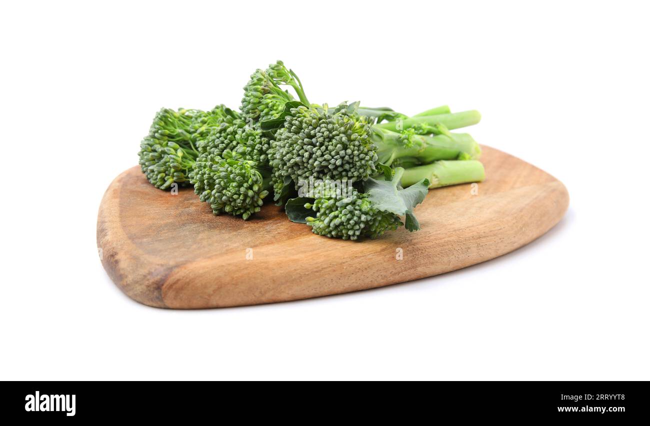 Wooden board with fresh raw broccolini isolated on white. Healthy food ...