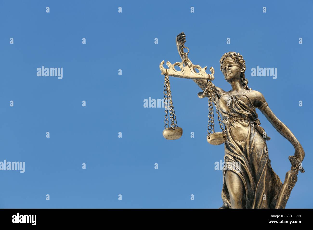 Symbol of fair treatment under law. Figure of Lady Justice against sky ...