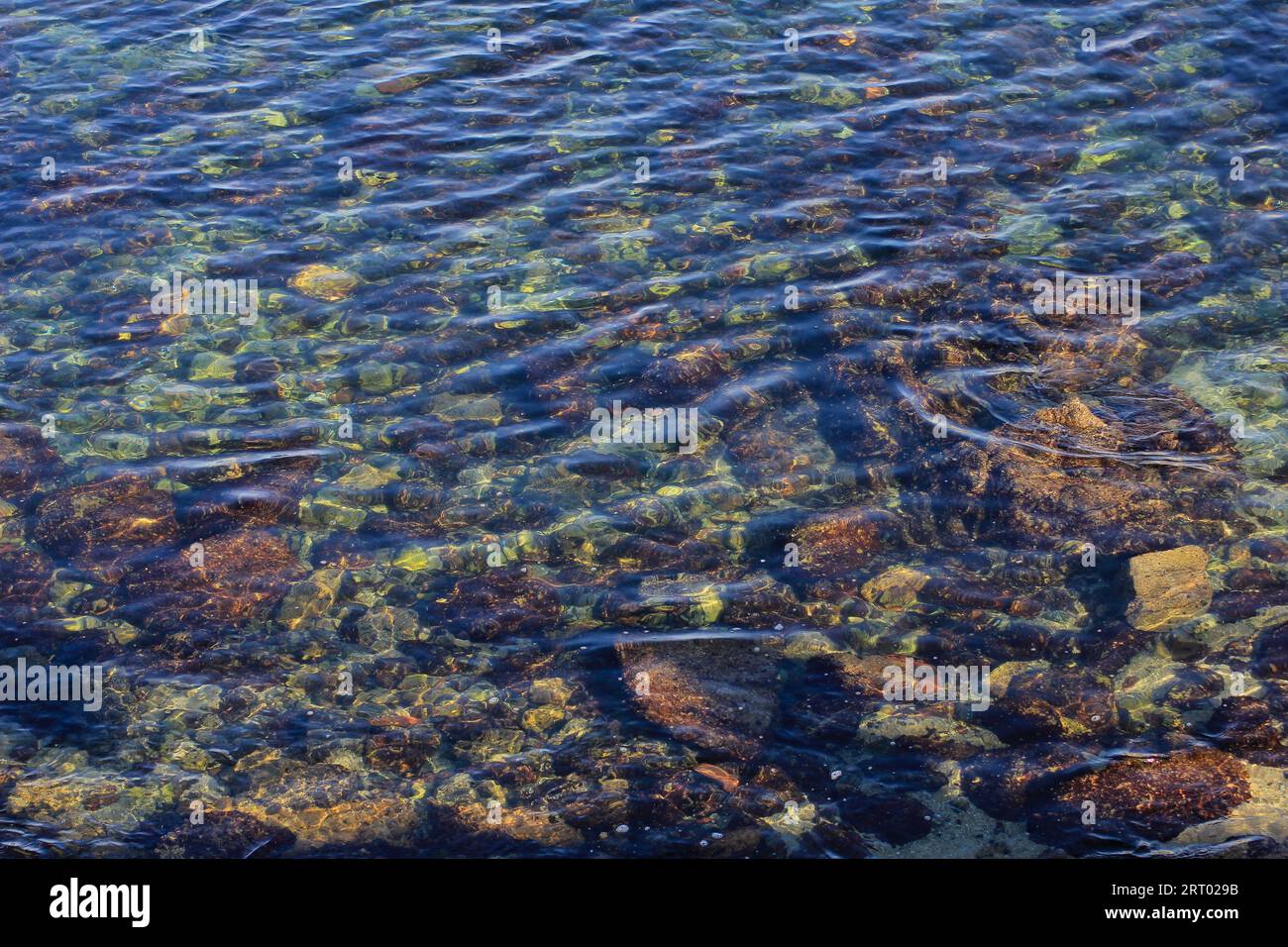 Colored rocks under water along shore of Monterey Bay Stock Photo - Alamy