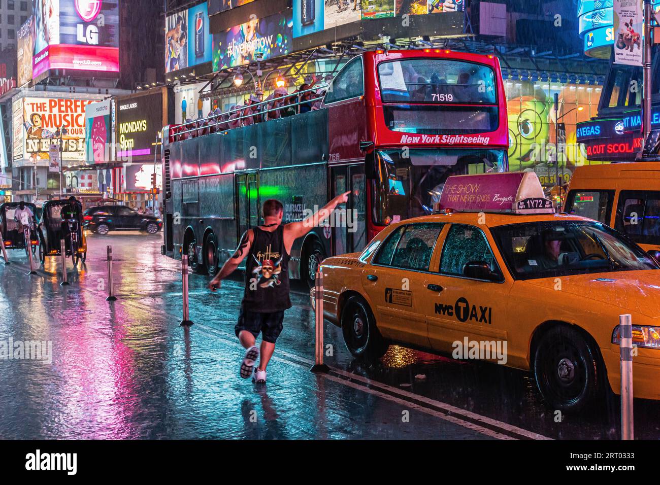 Hailing a Cab Rain Times Square Theater District Manhattan New York ...