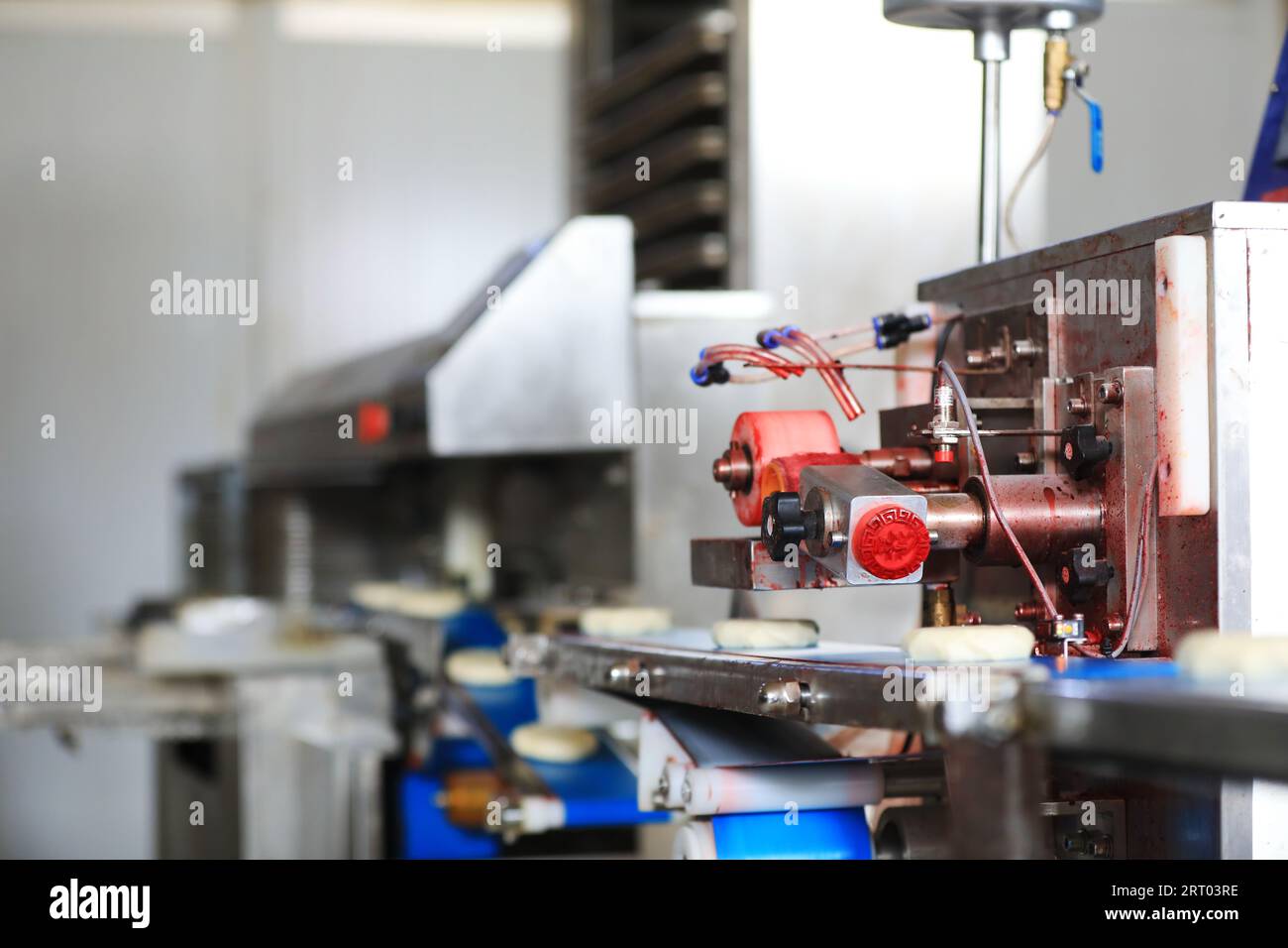 The running moon cake production line is in a food processing plant in ...