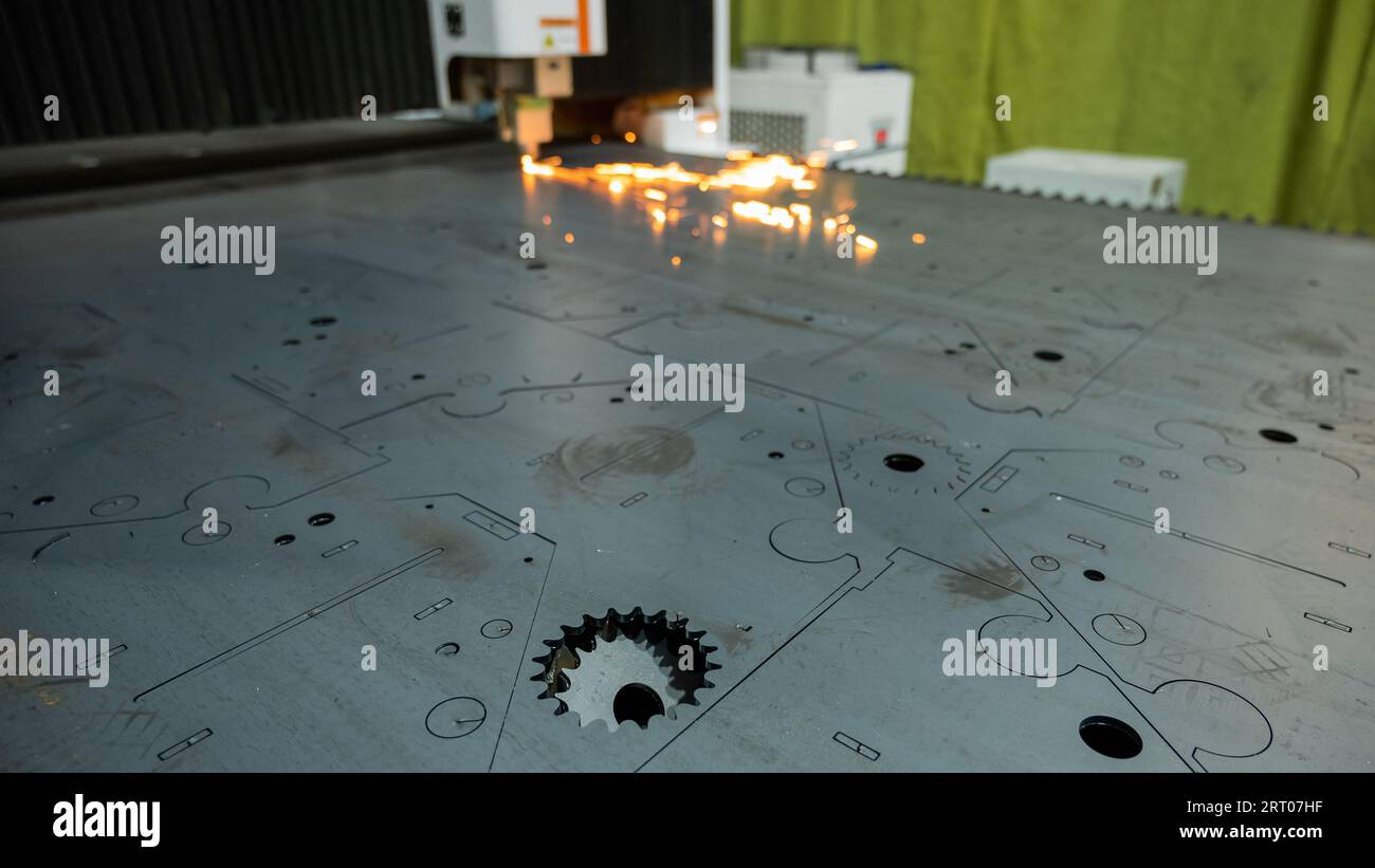 CNC machine. Laser cutting of metal. Sparks Stock Photo - Alamy