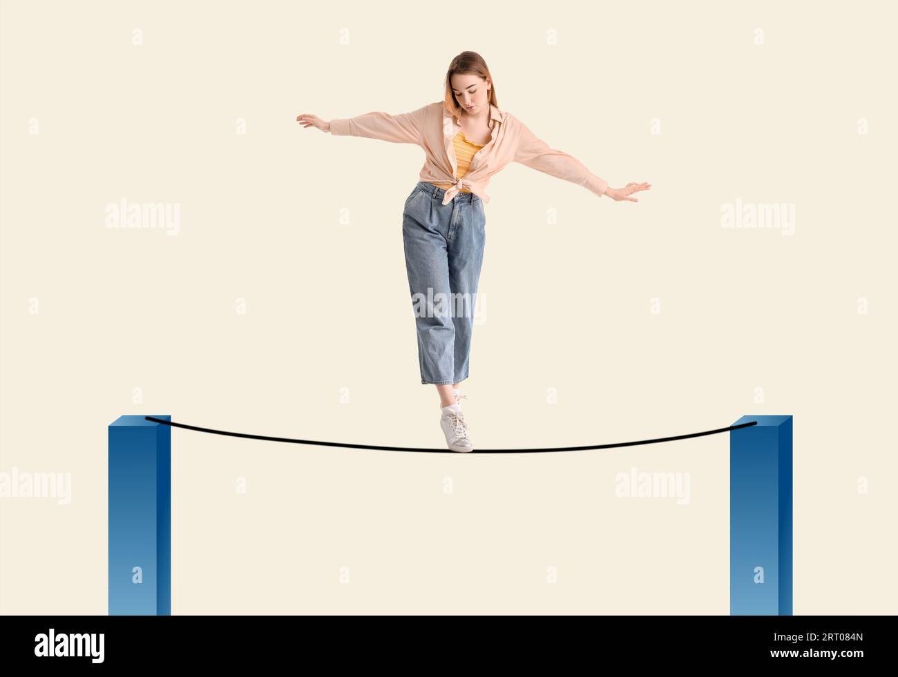 Young woman balancing on rope against light background Stock Photo - Alamy