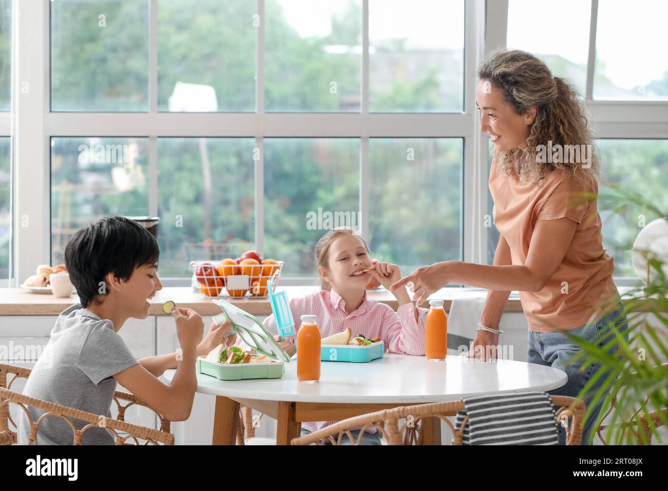 Girl packing lunch mother hi-res stock photography and images - Alamy