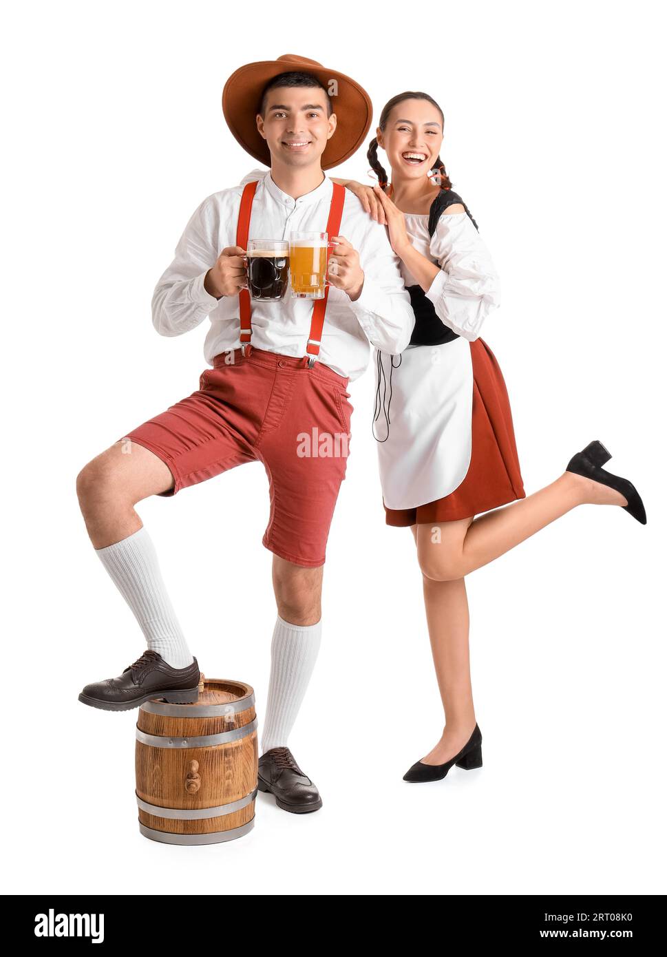 Young couple in traditional German clothes with beer on white ...