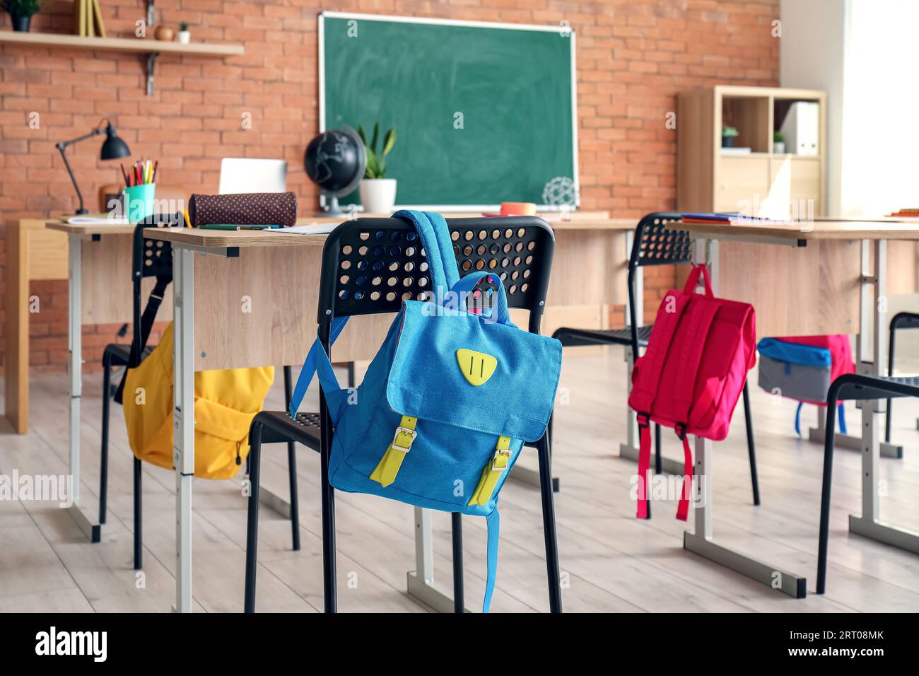 Children backpacks classroom table hi-res stock photography and images ...