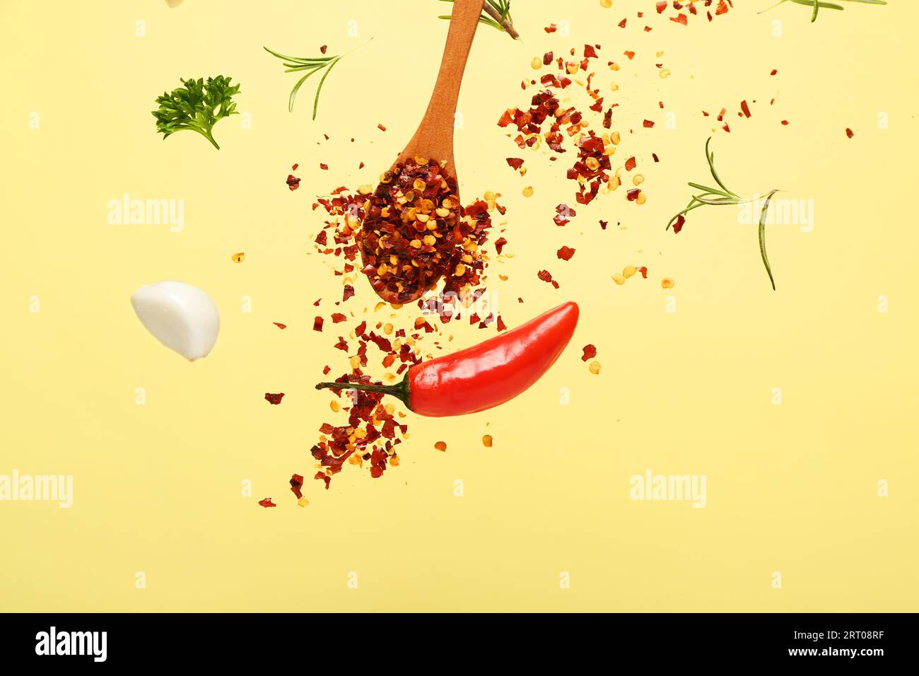 Flying spices and herbs on color background Stock Photo - Alamy