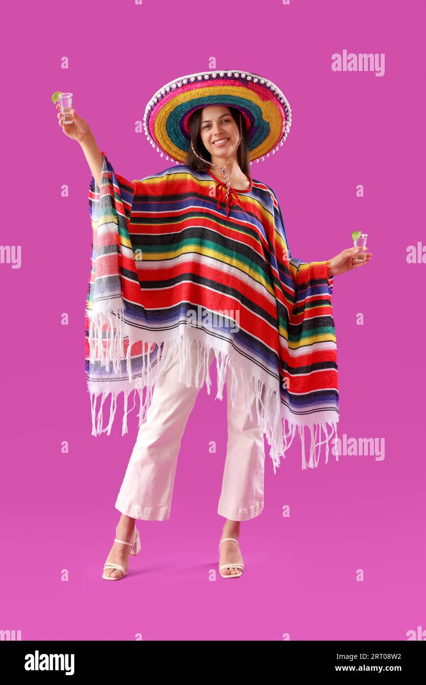 Beautiful young Mexican woman with tequila on magenta background Stock ...