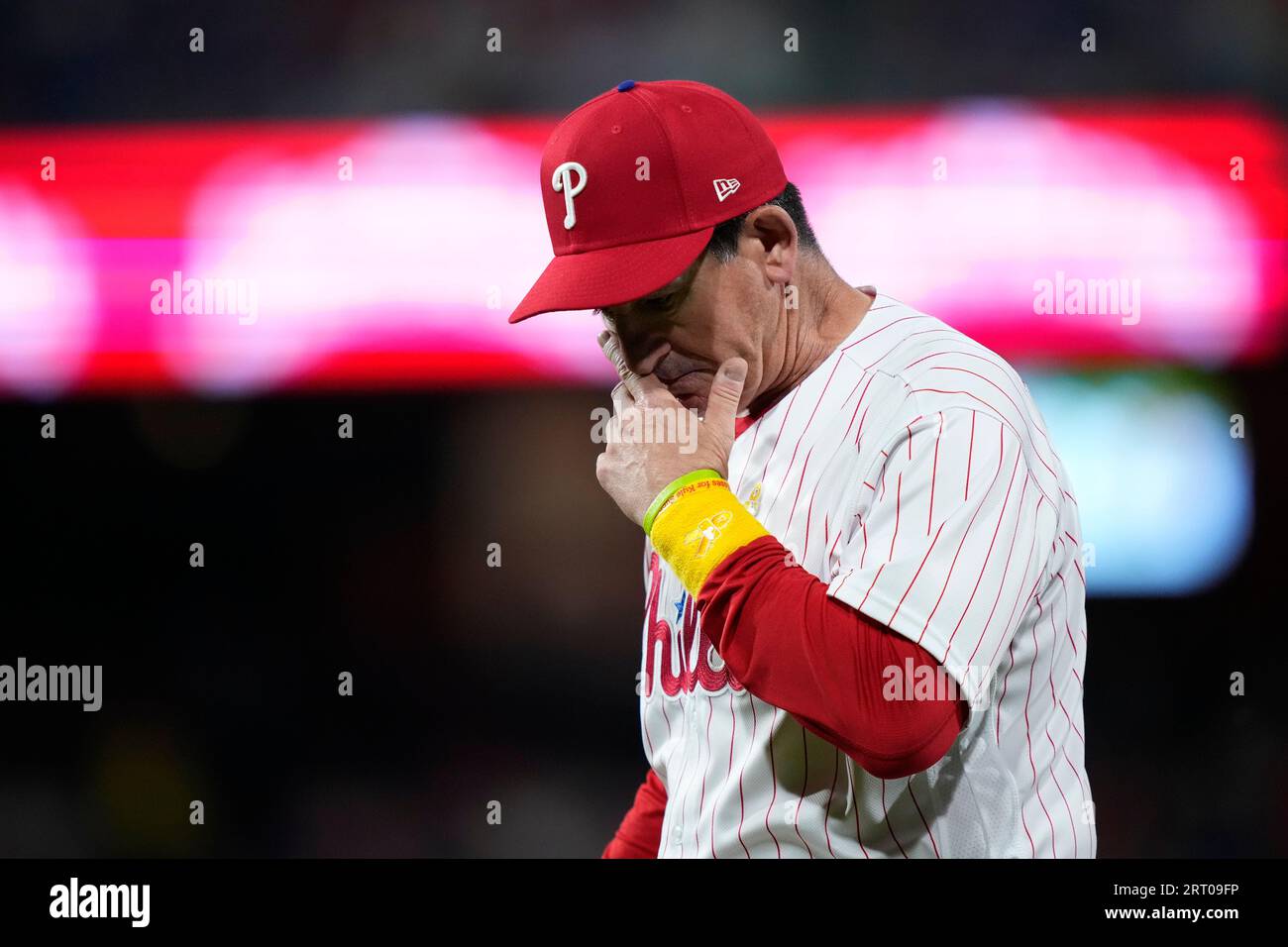Philadelphia Phillies' Rob Thomson walks the field during a baseball ...