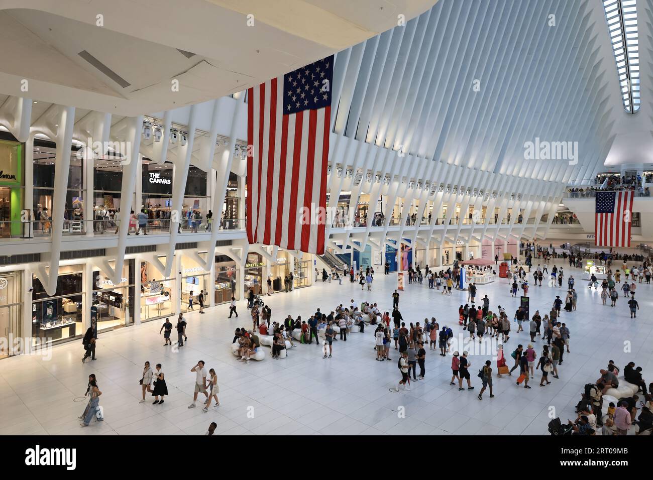 The Oculus at the World Trade Center is fill with crowds as U.S. flags ...