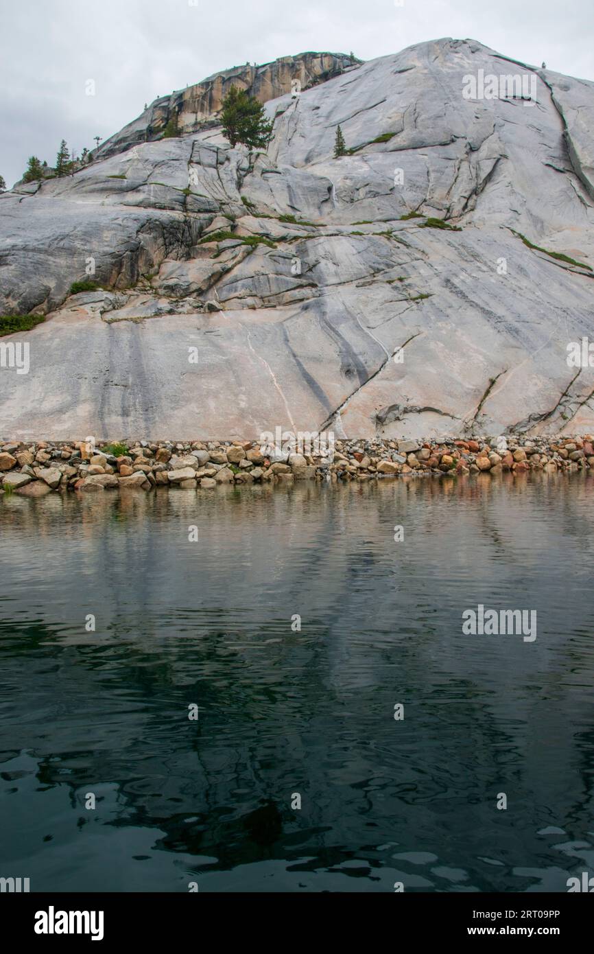 Temporary waterfalls form on the granite domes surrounding Tenaya Lake ...