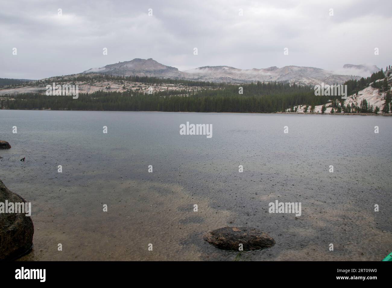 Temporary waterfalls form on the granite domes surrounding Tenaya Lake ...