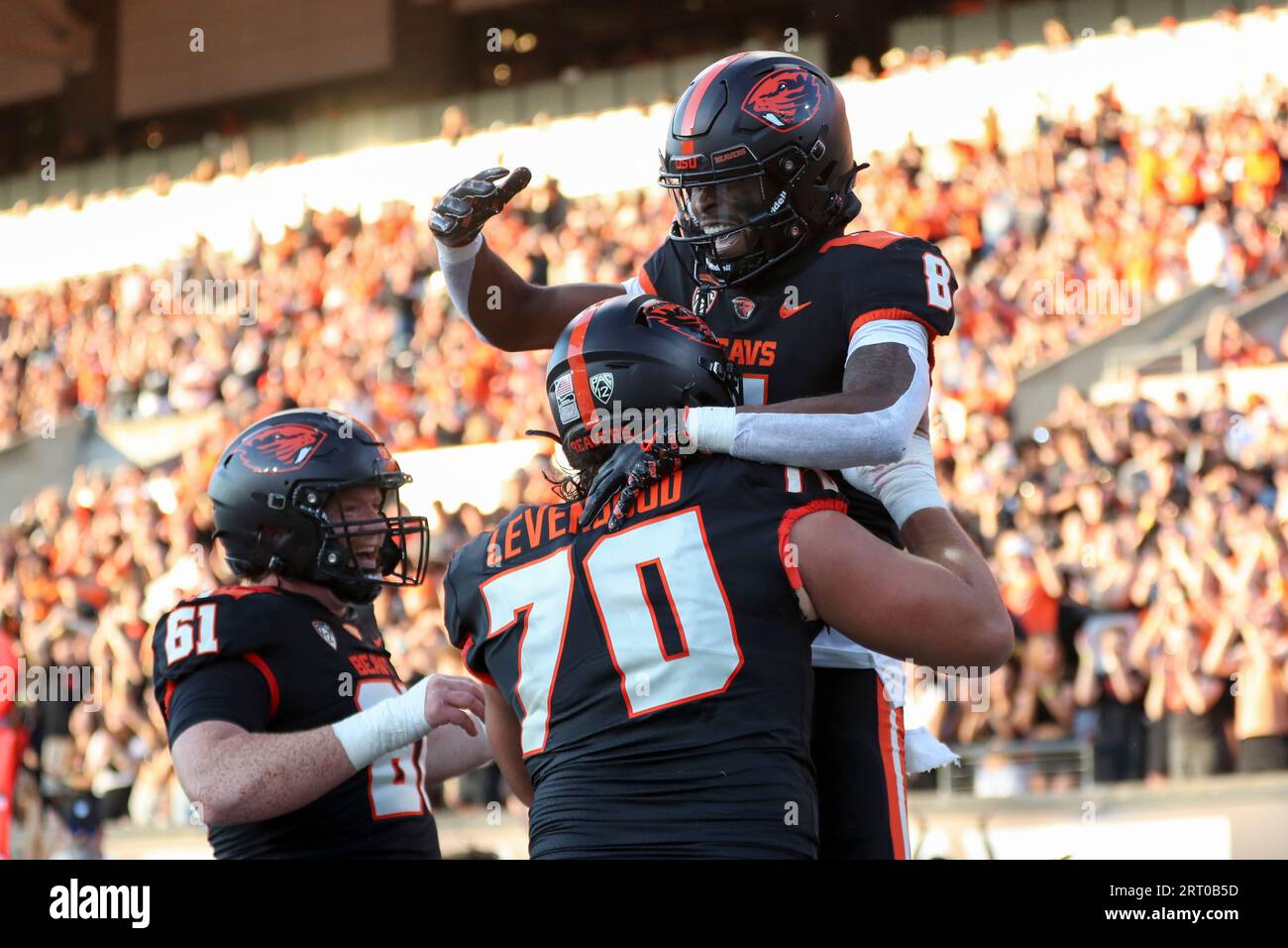 Oregon State wide receiver Rweha Munyagi Jr. (8) is lifted by offensive ...