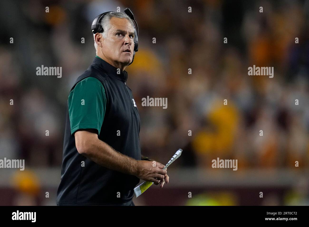 Eastern Michigan coach Chris Creighton walks on the field during the second half of the team's ...