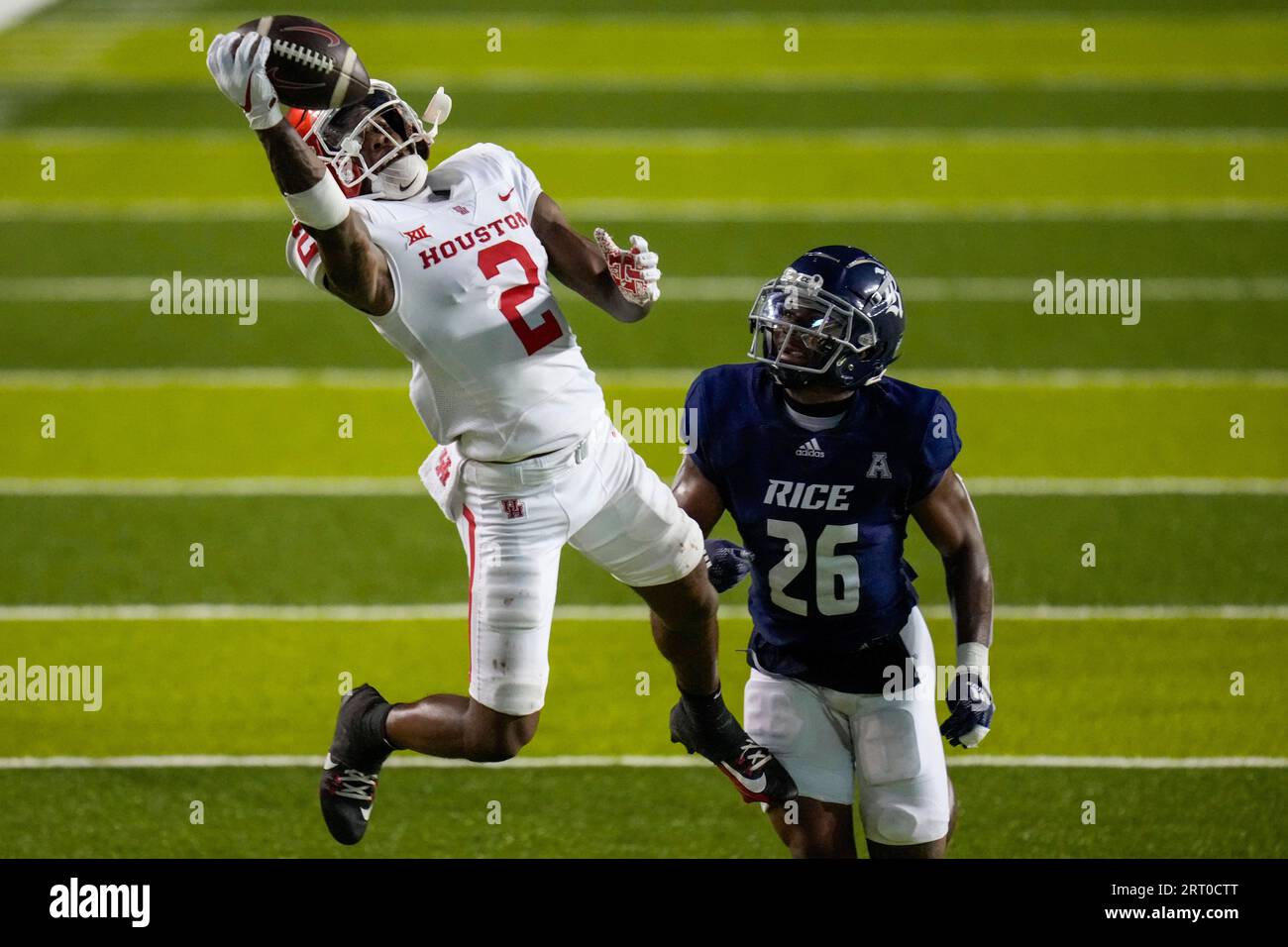 Houston wide receiver Matthew Golden (2) catches a pass as Rice safety ...
