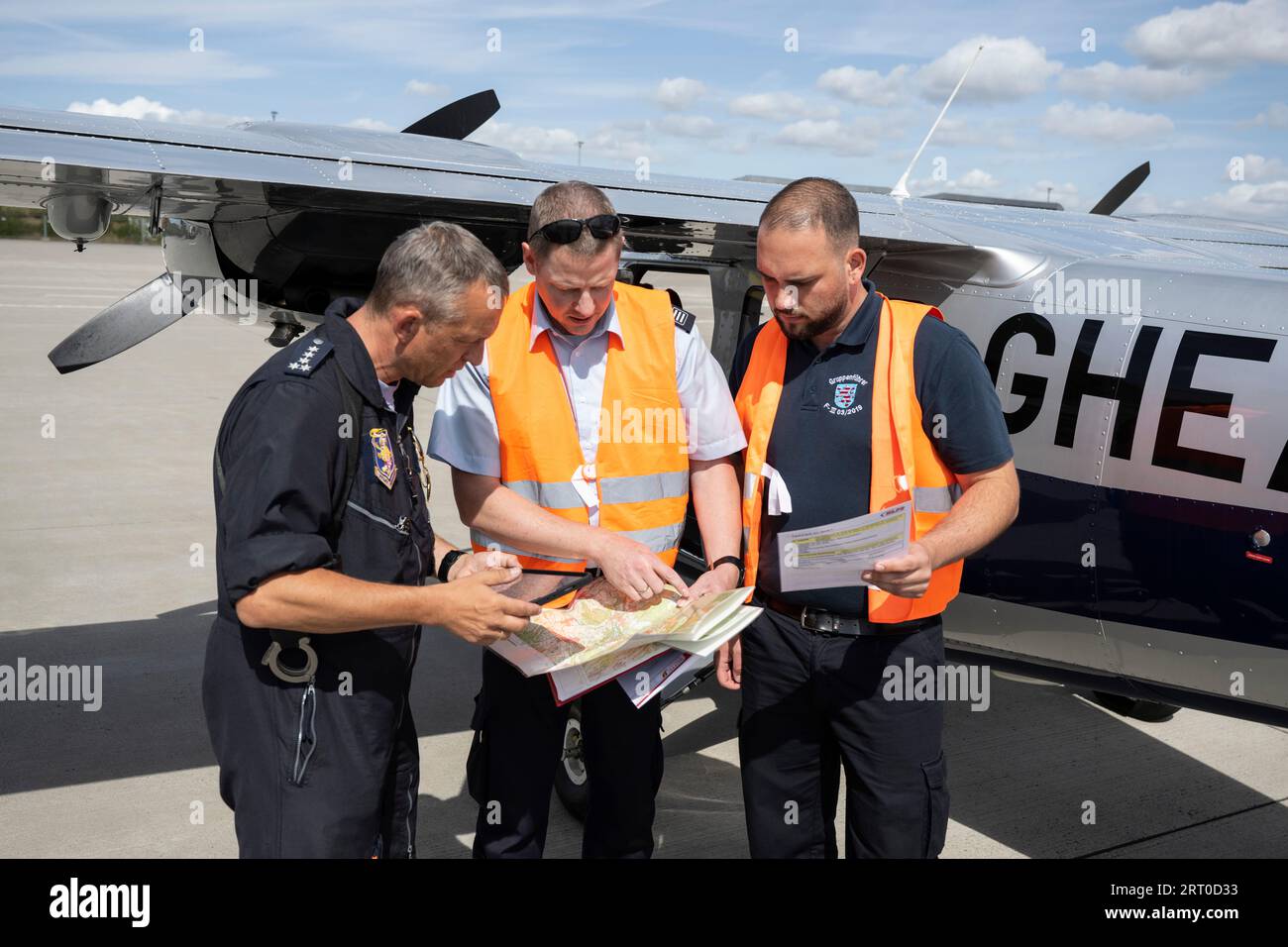 Kassel, Germany. 13th July, 2023. A police pilot chats with two trainee ...