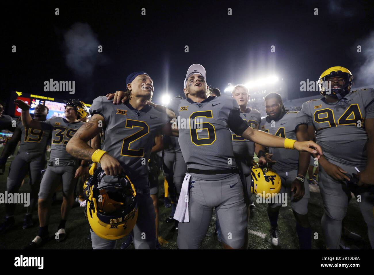West Virginia's Rodney Gallagher III (2) and Garrett Greene (6 ...