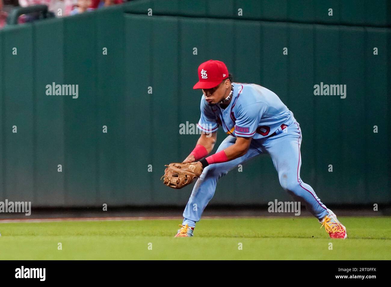 St. Louis Cardinals shortstop Masyn Winn, right, fields the ball to ...