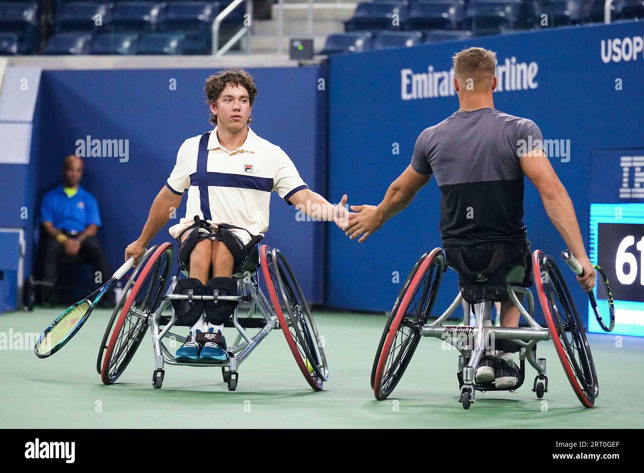 Charlie Cooper and Tomas Majetic high five during a junior wheelchair boys' doubles championship ...