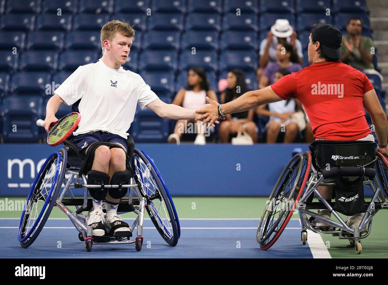 Joshua Johns and Dahnon Ward high five during a junior wheelchair boys ...