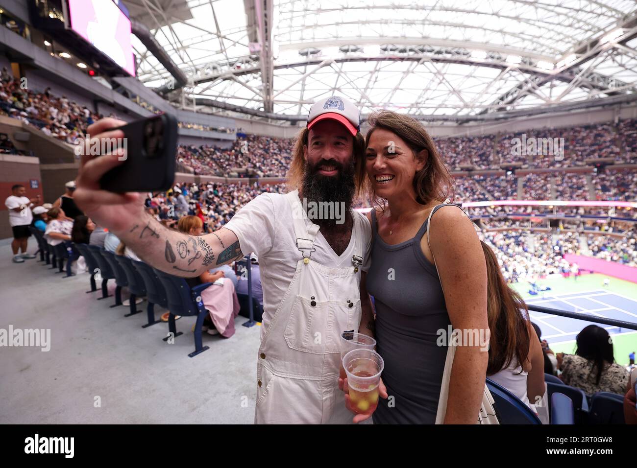 Fans pose for a photo during a women's singles championship match at ...